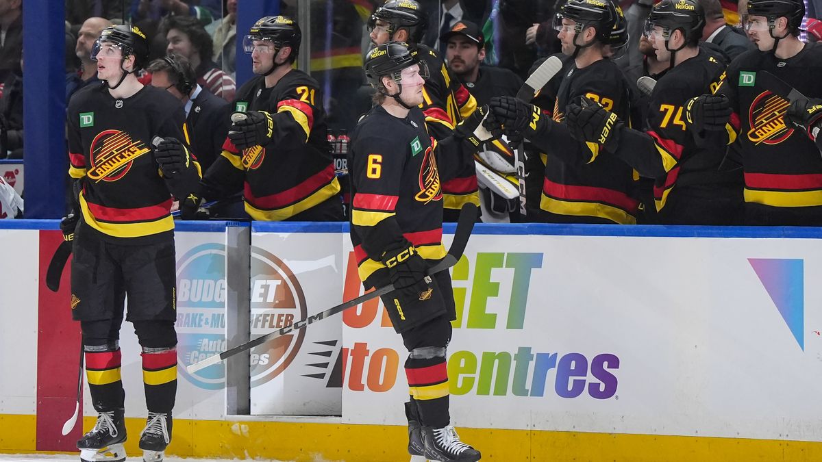 Canucks rally to end 11-game losing streak with 4-3 win over Capitals ...