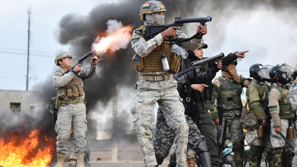 Protesters, police clash in Bolivia after president signs law enabling ...