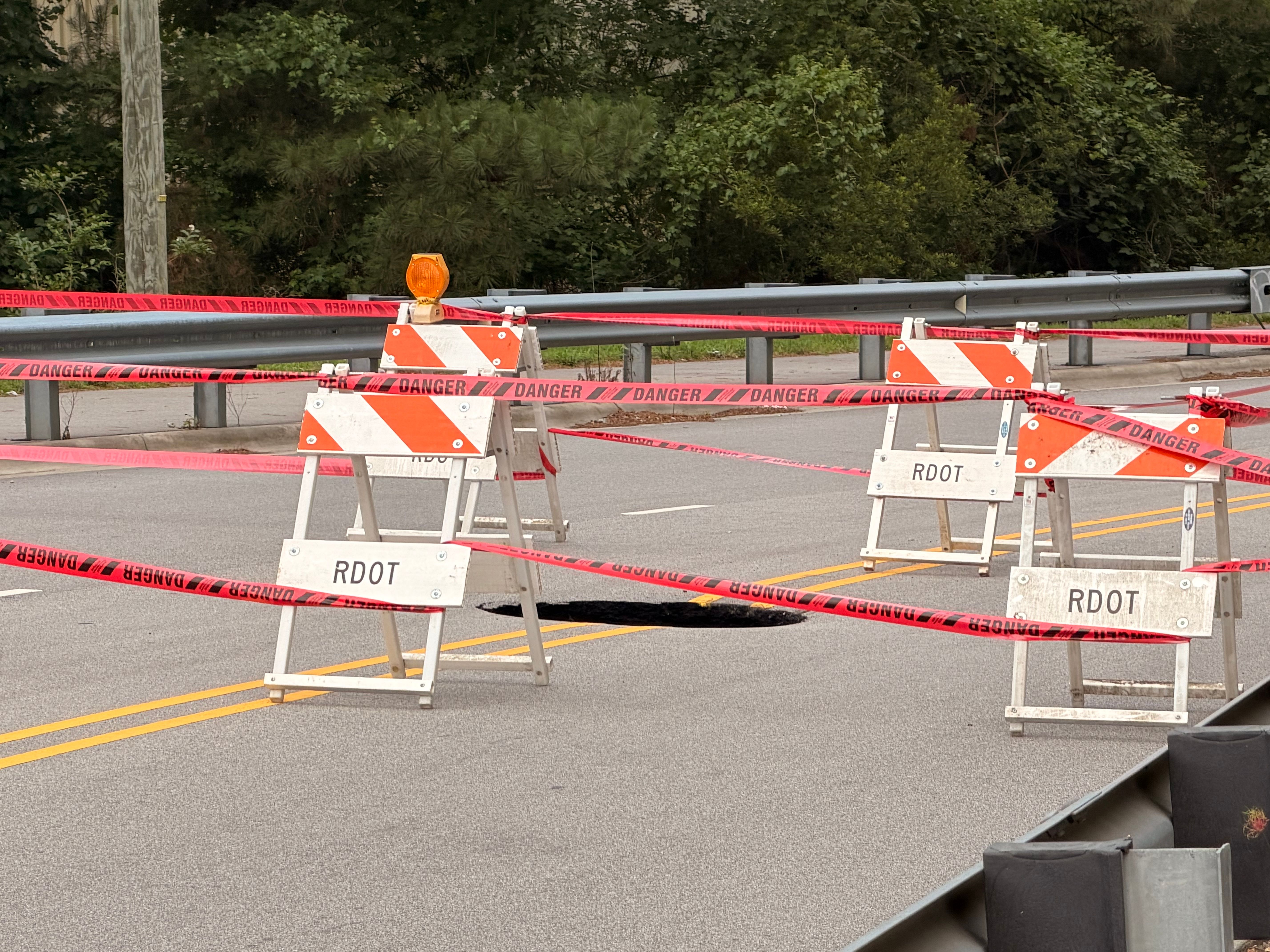 Large sinkhole blocks traffic on Yonkers Road in Raleigh :: WRAL.com