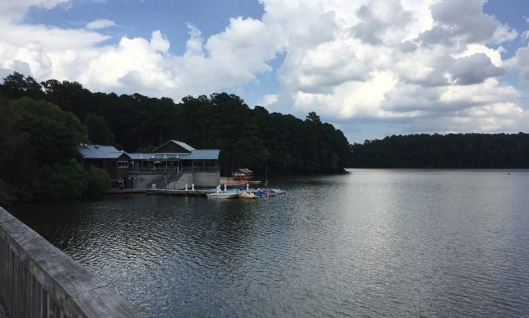 Read and hike along the loop trail at Lake Johnson Park