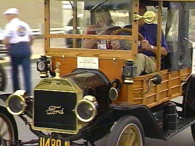 Antique Cars Drive Through Triangle