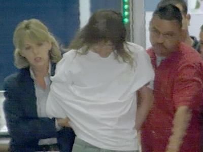 Murder suspect's mother files lawsuit against state