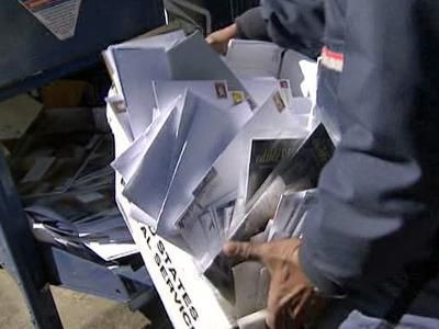 Triangle post office mailboxes overflowing