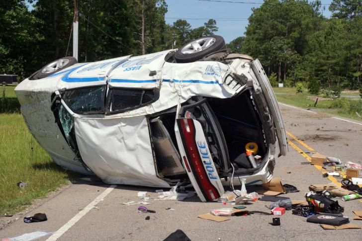 Vass officer flips patrol car