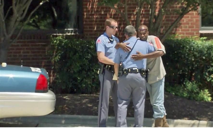 Raleigh workers stop to thank, hug police officers