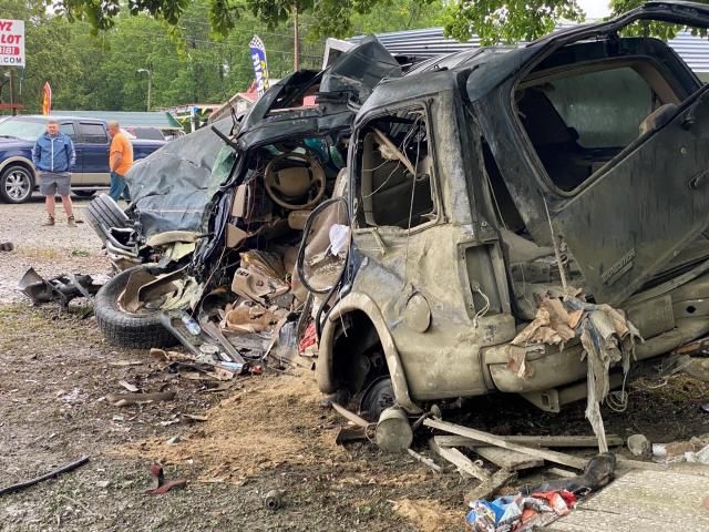 SUV runs stop sign, is struck by tractor-trailer