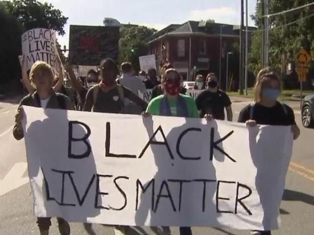 Some police and protesters circle together during peaceful rallies