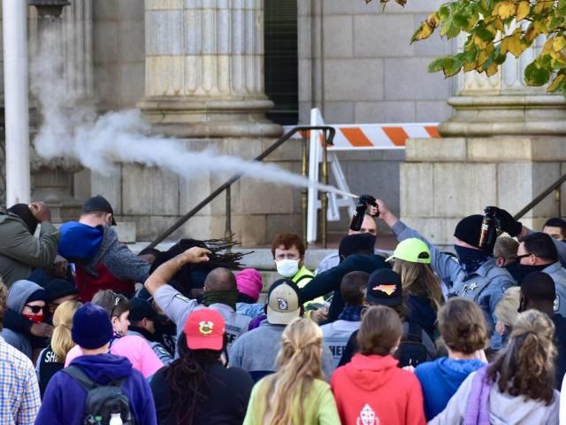 Police pepper spray crowd during march to polls in front of Graham ...