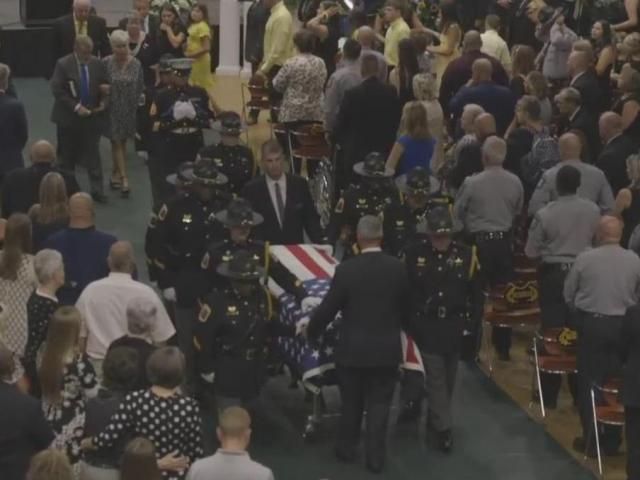 Emotional: Fellow law enforcement officers carry flag-draped casket of ...