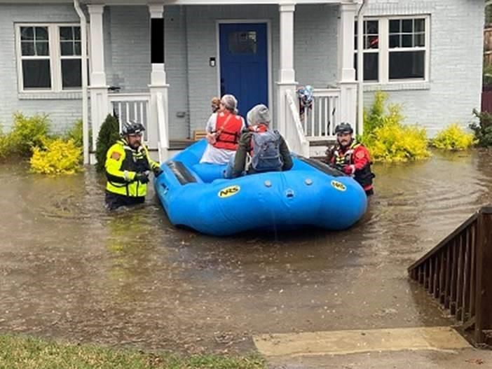 Man and woman rescued after rising water surrounded their family home ...