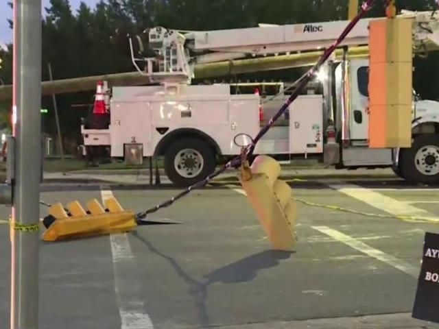 Crash knocks down traffic lights, blocking Main Street in Durham