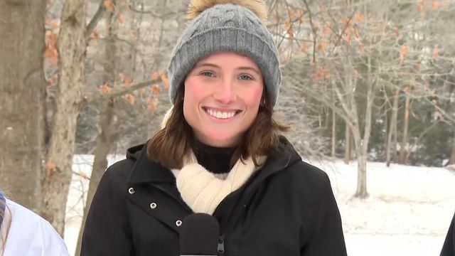 WRAL reporter Caroline Yaffa gets in on the sledding fun