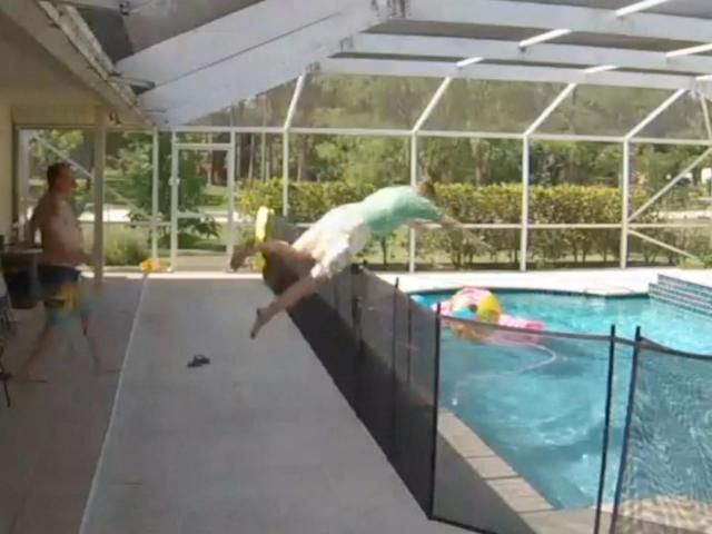 Caught on camera: Dad dives in to save son after falling in pool