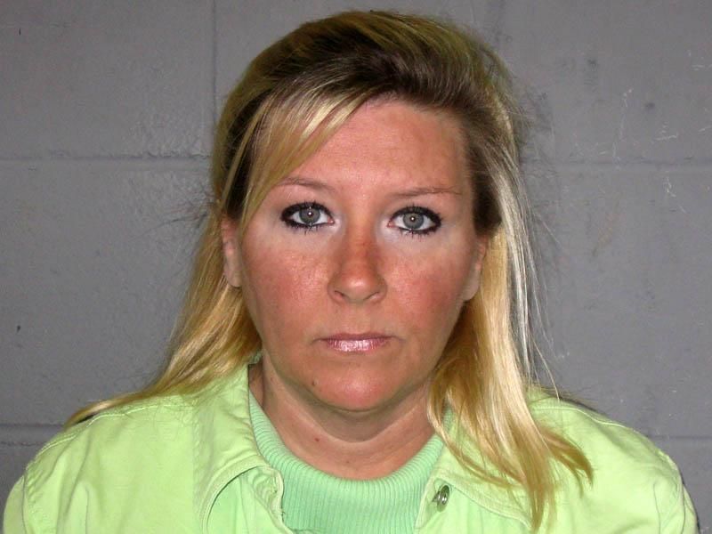 Police: Woman stole from Realtors group