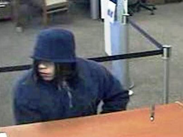 Police: Wig-wearing bank robber fled on pink bike