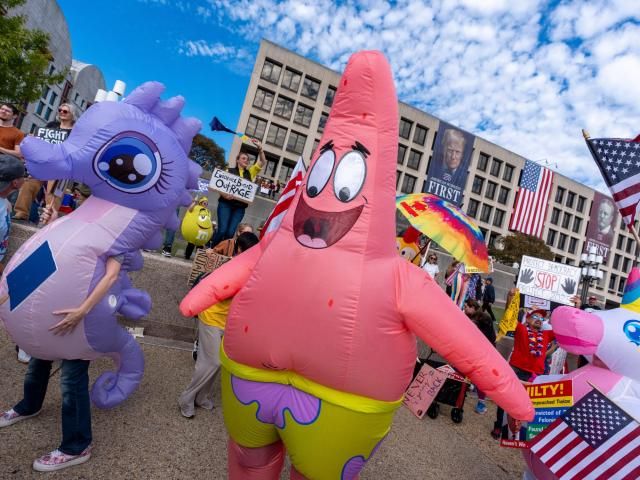 Inflatable costumes used to deflate tensions at rallies against Trump ...