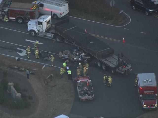SUV becomes wedged under truck near Angier