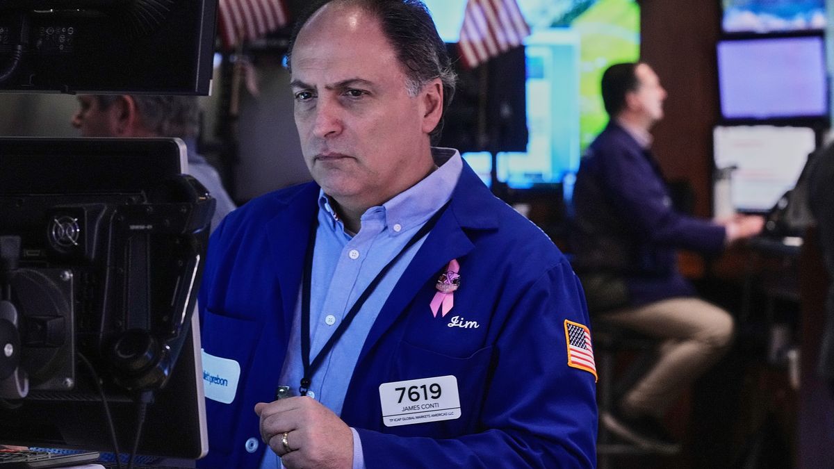 Stocks edge a bit below their latest records on Wall Street :: WRAL.com