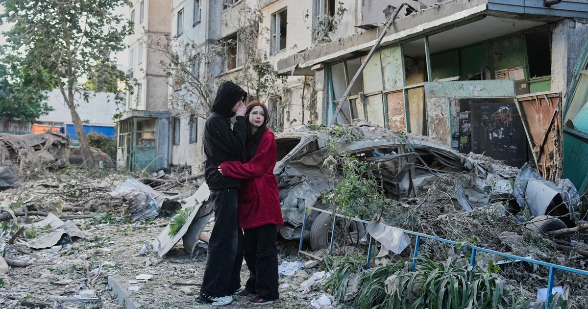 Russian attack on Ukraine capital kills at least 3 and traps others in ...
