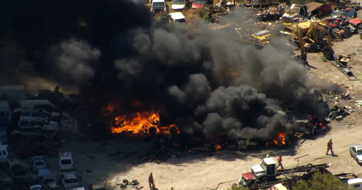 Durham salvage yard fire pours black smoke into sky :: WRAL.com